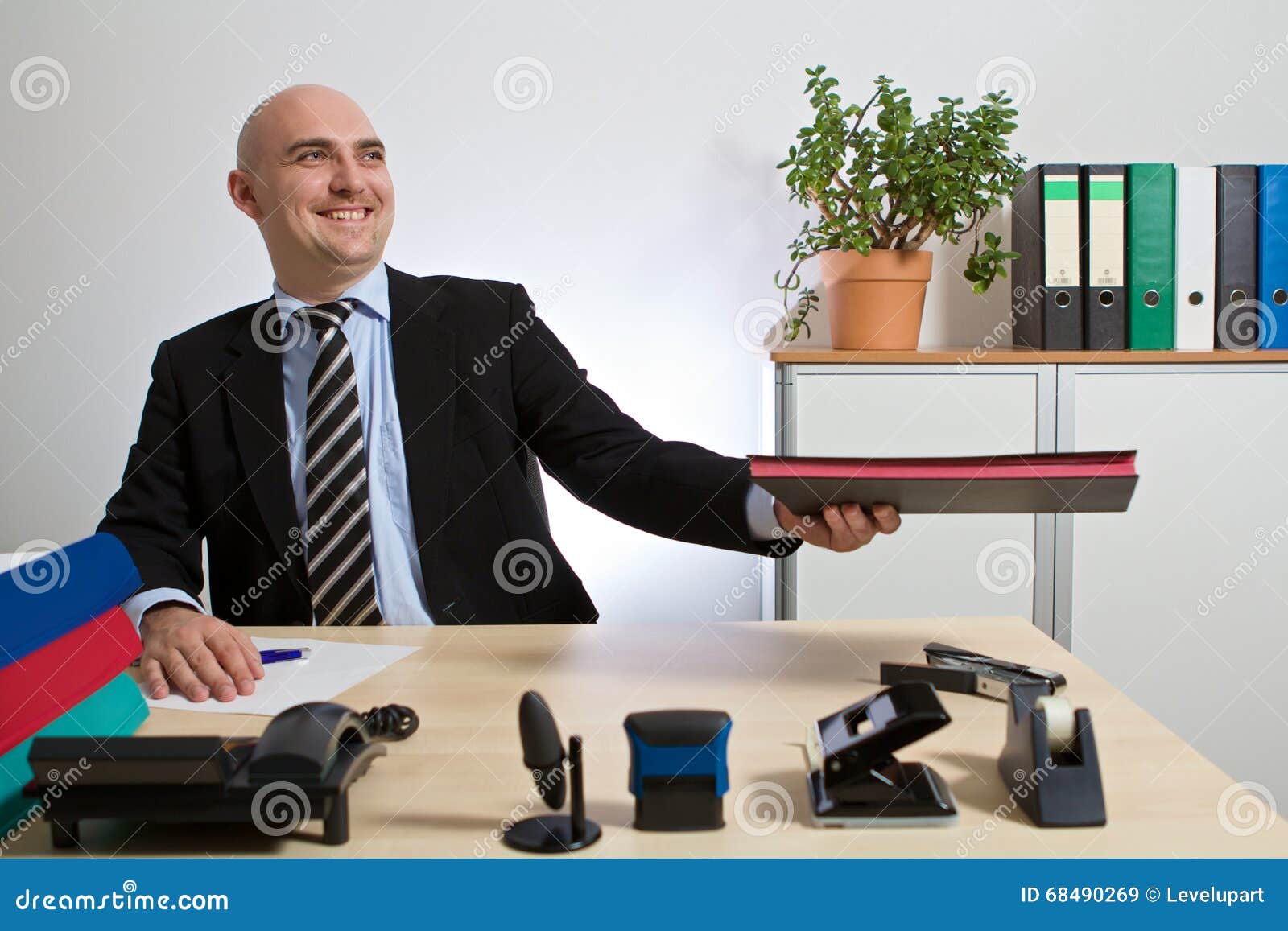 Boss handed over a folder stock image. Image of decide - 68490269