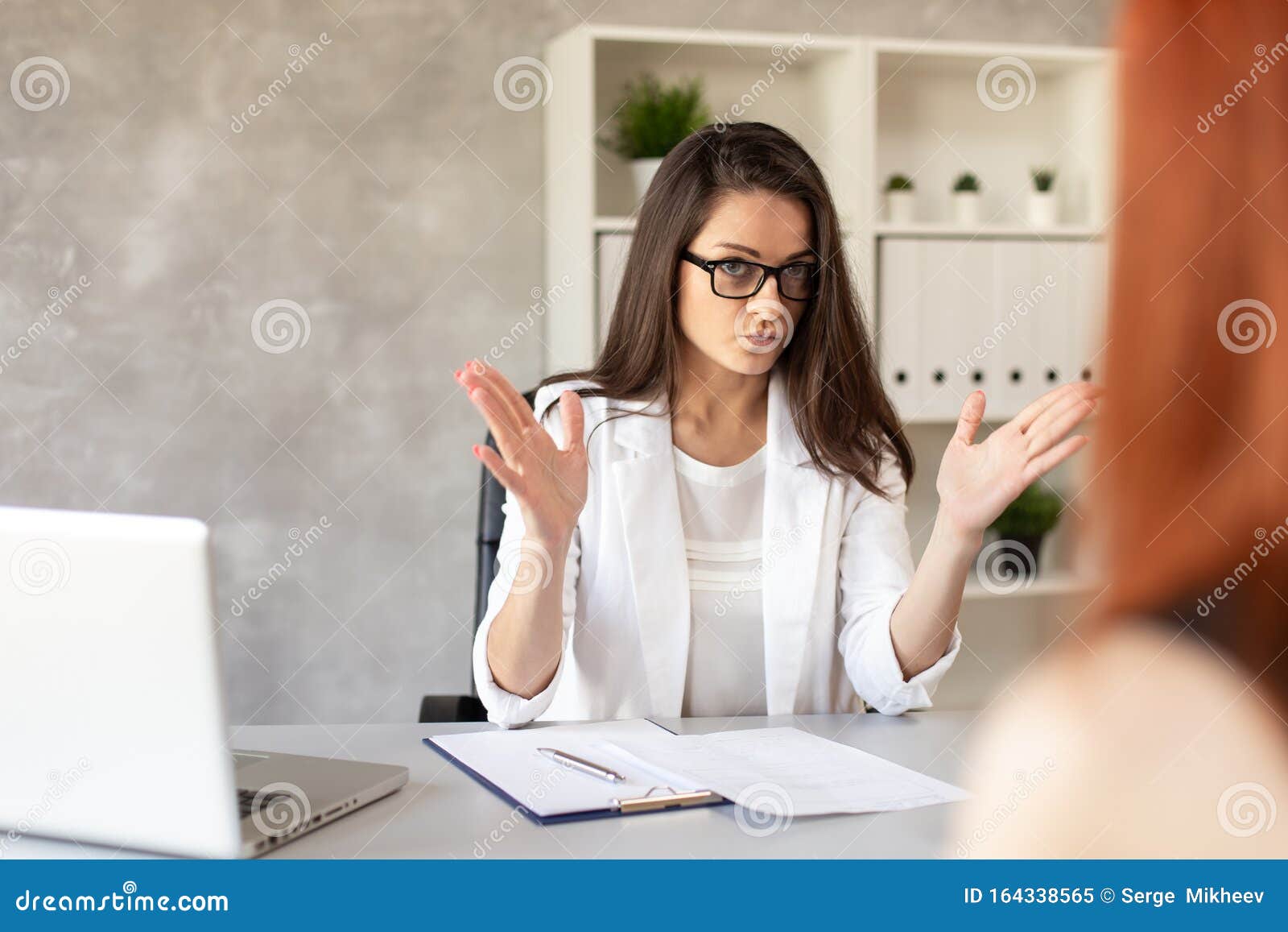 Boss Has Private Conversation with Her Worker in Her Cabinet. Selective ...