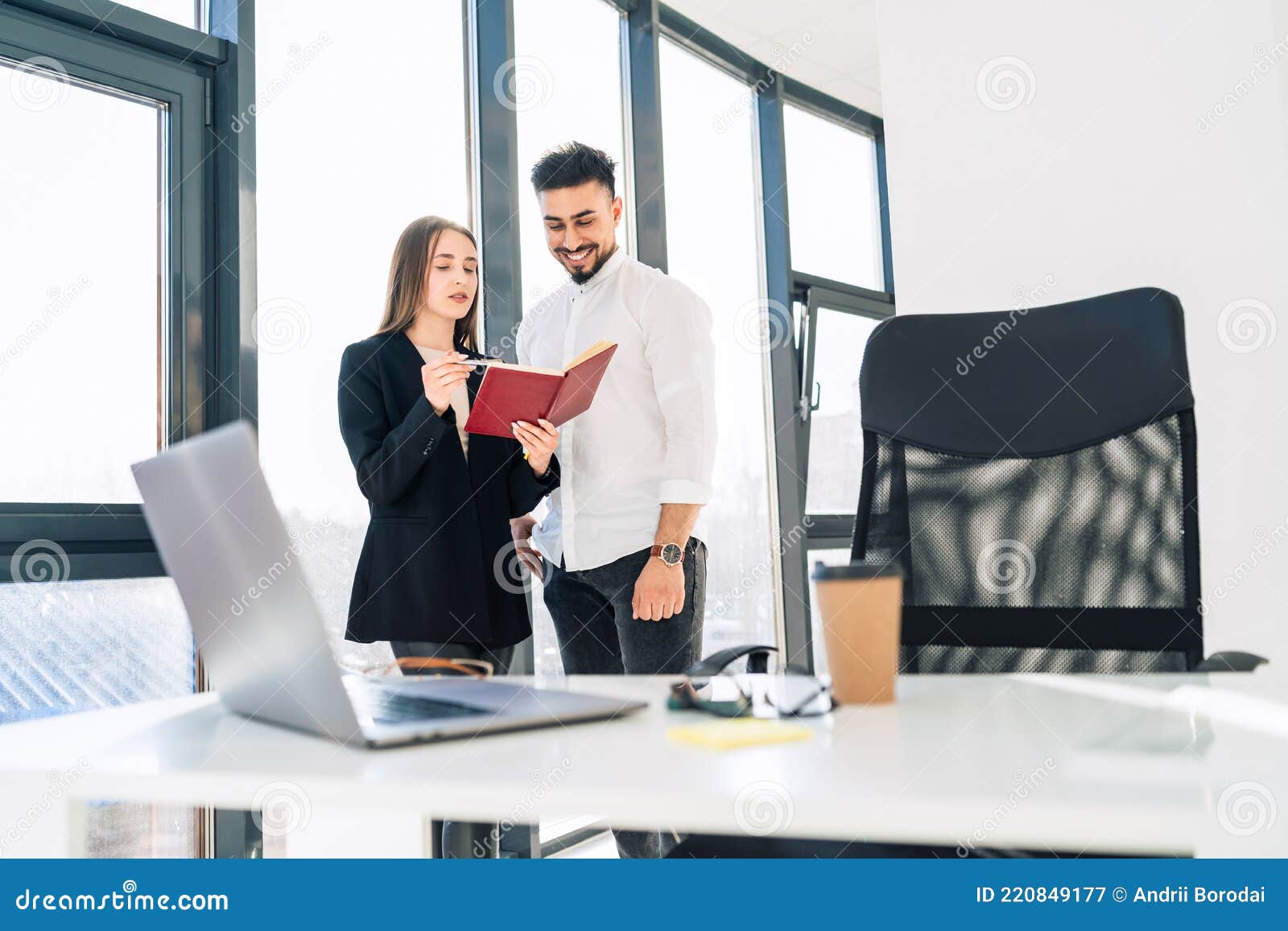 Boss and His Secretary Stand in the Office. Stock Image - Image of ...