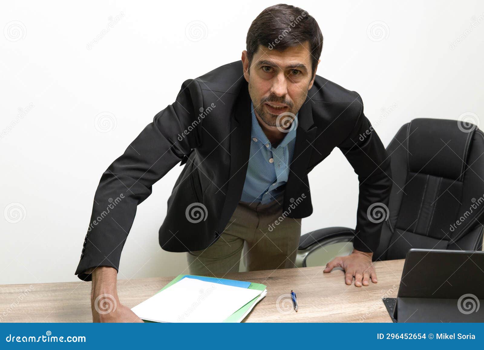 Boss in Office with Aggressive Pose Looking at and Approaching Camera ...