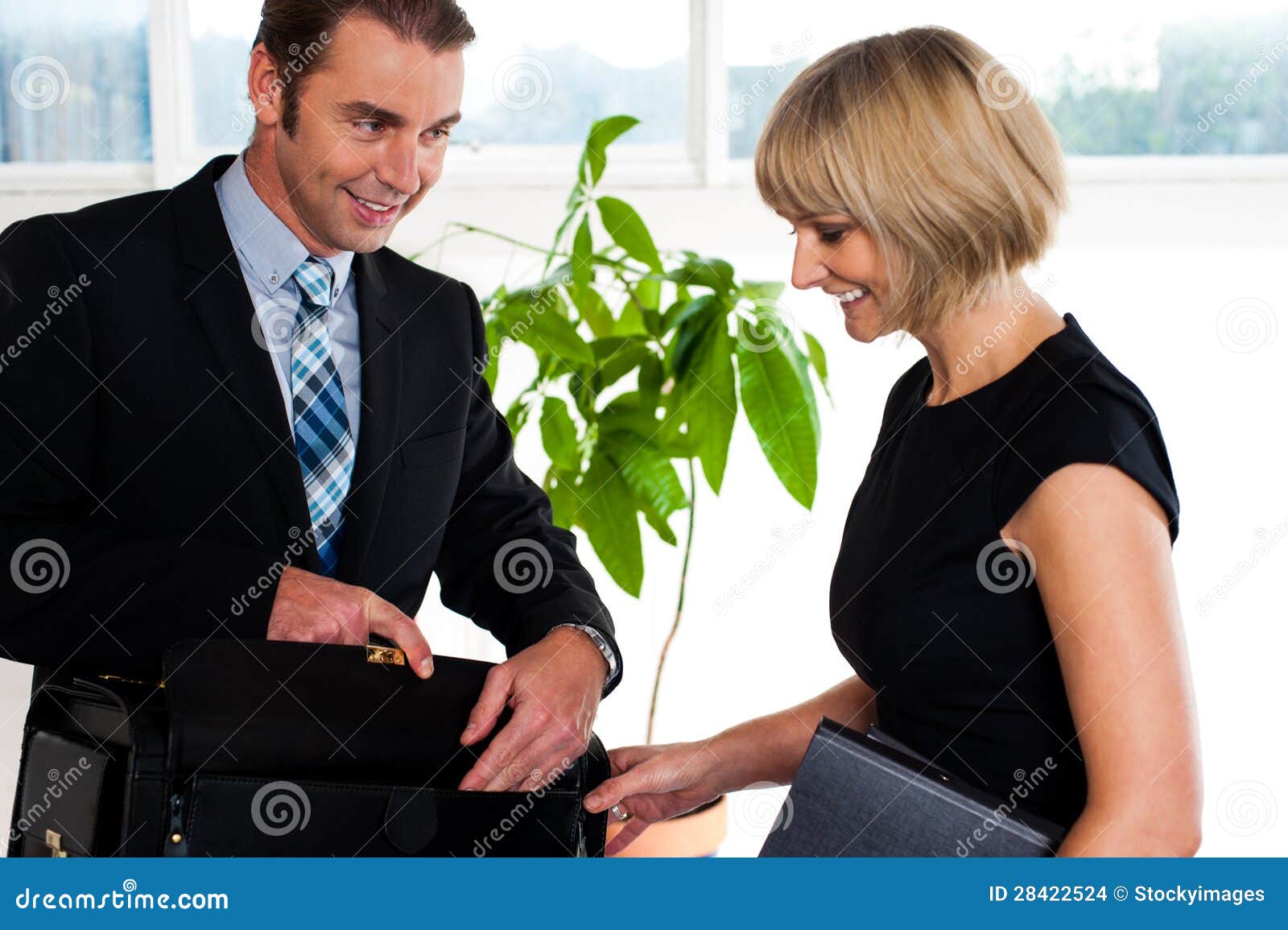 Boss Opening His Briefcase in Front of Secretary Stock Photo - Image of ...