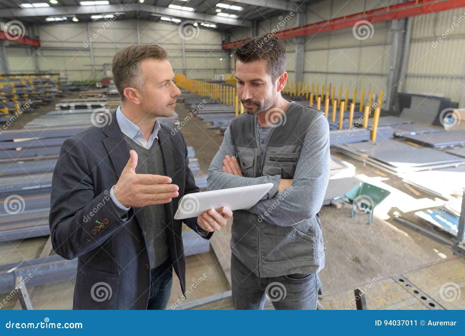 Boss and Worker in Conversation in Factory Stock Image - Image of ...