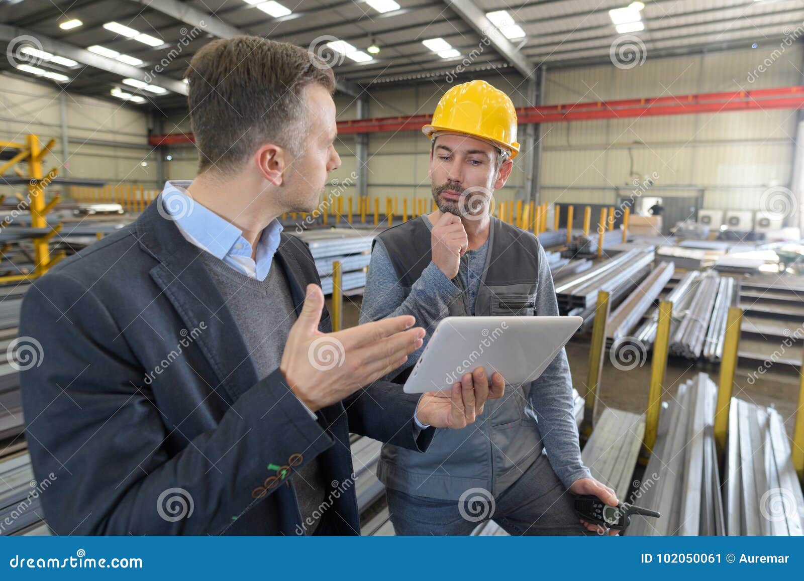 Boss and Worker in Conversation in Factory Stock Image - Image of ...