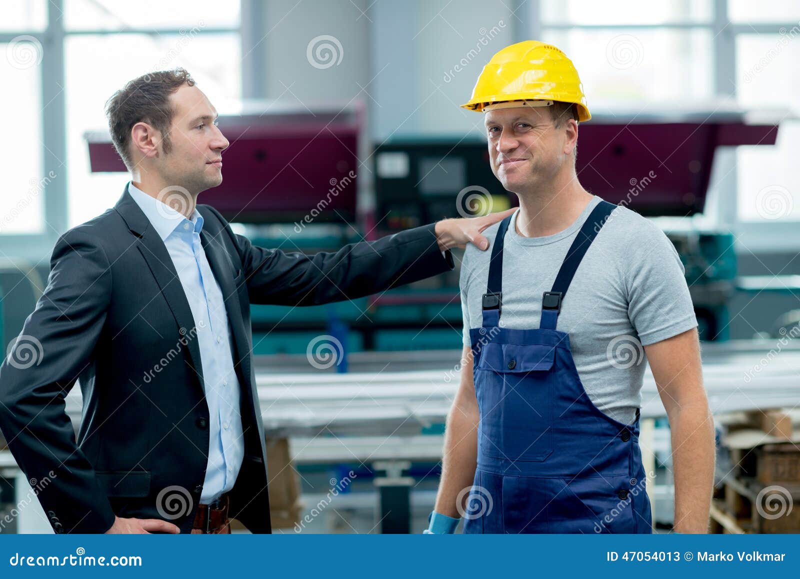 Boss and worker in factory stock image. Image of industrial - 47054013