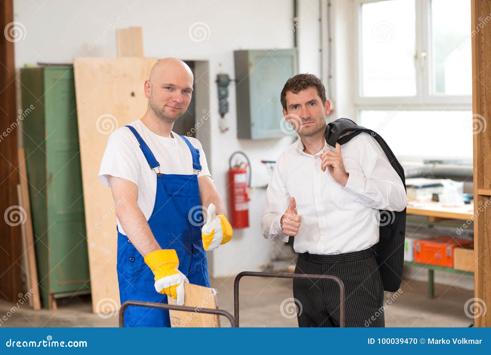 Boss and Worker with Thumb Up in a Carpenter`s Workshop Stock Photo ...