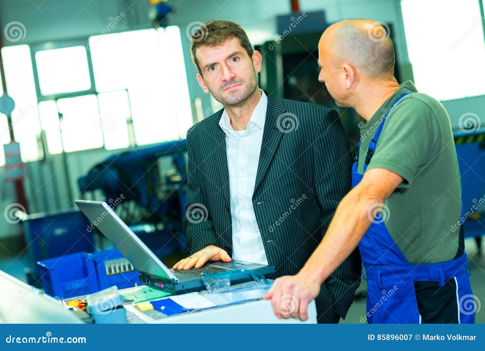 Boss and Worker on Work Bench Stock Image - Image of positive, control ...