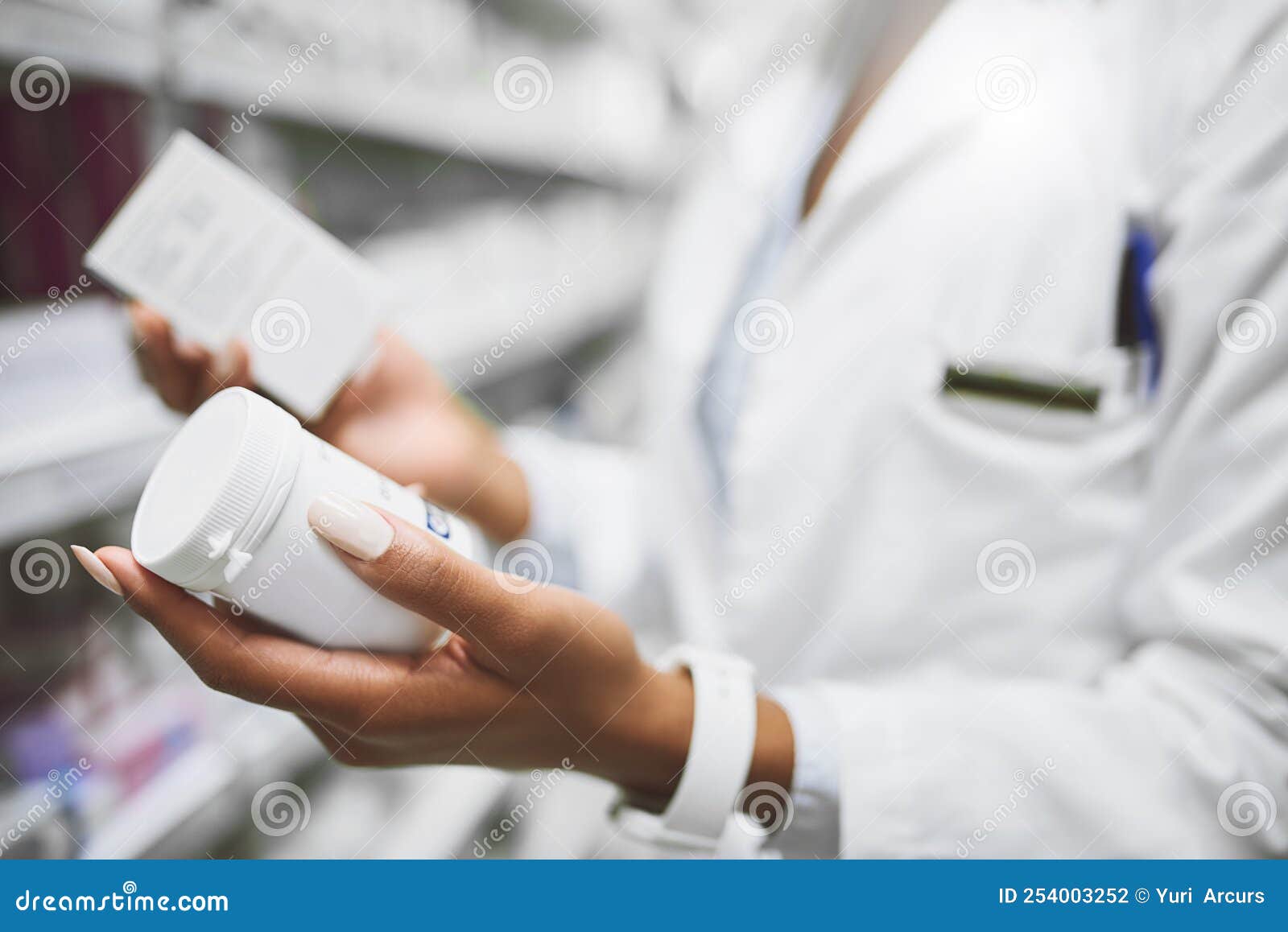 Both are Important To Take daily. a Unrecognisable Female Pharmacist ...