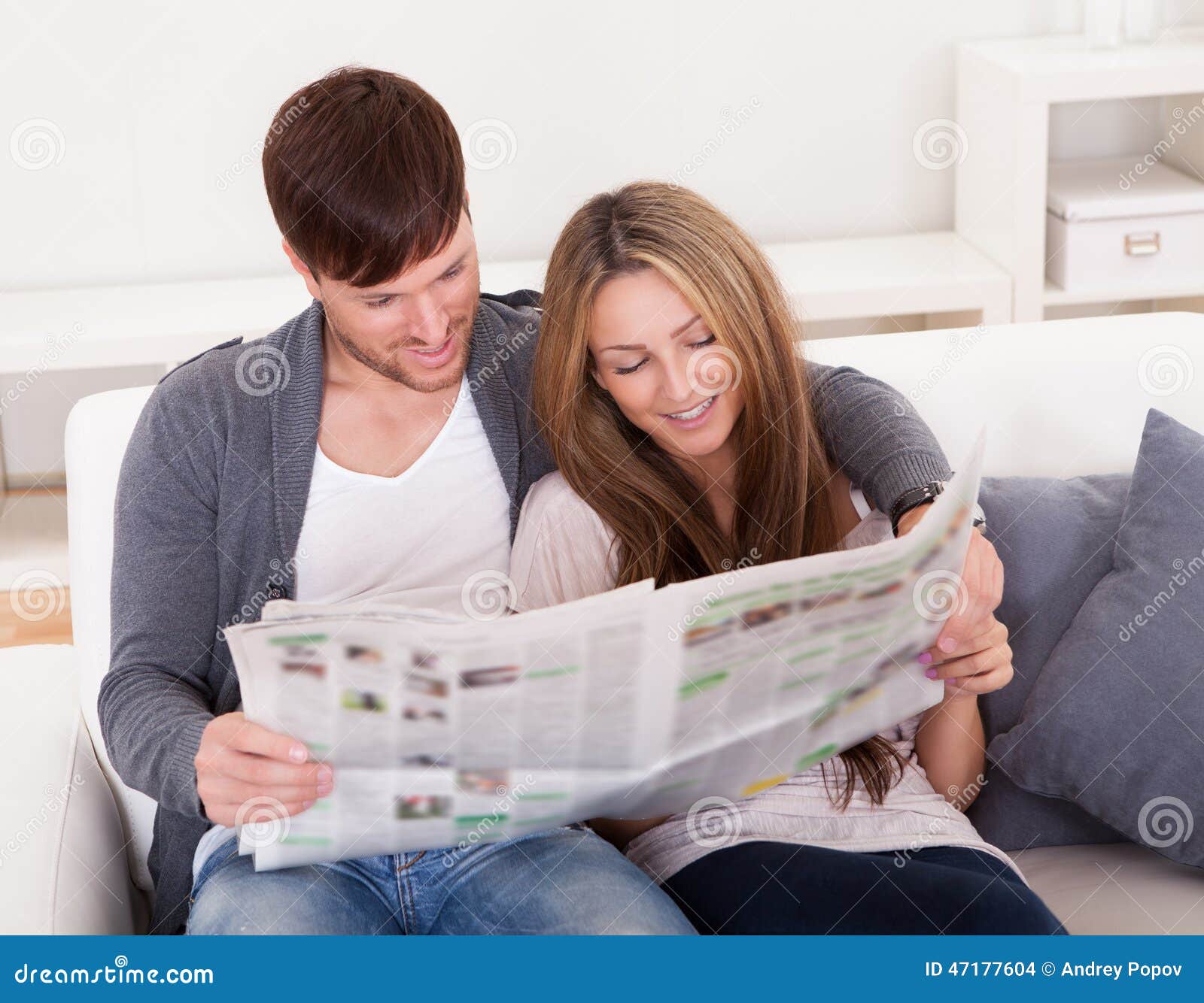 Both Read Article from Newspaper Stock Photo - Image of gorgeous ...