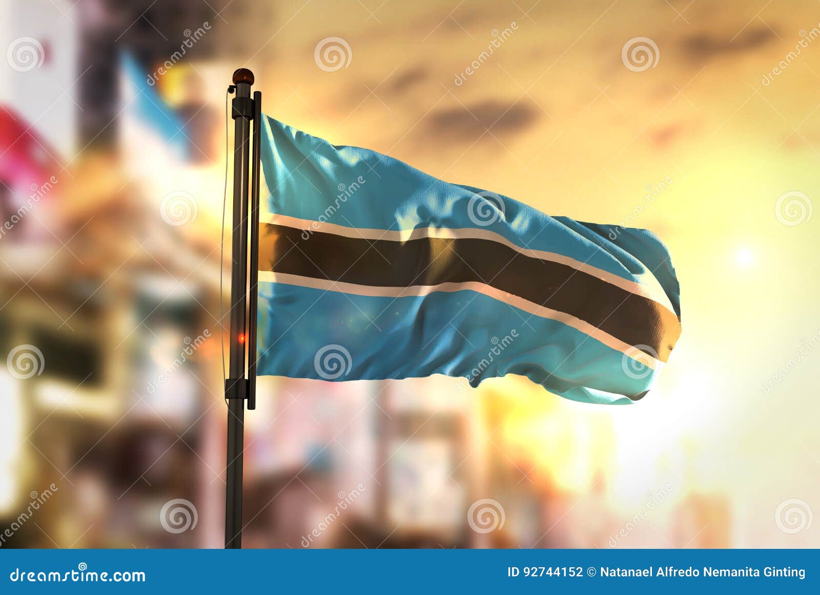 Botswana Flag Against City Blurred Background at Sunrise Backlight ...