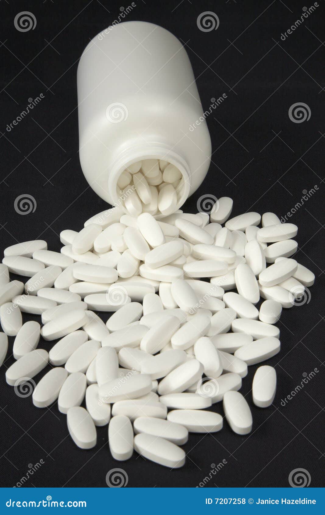 Bottiglia Bianca Che Rovescia I Caplets Ovali Fotografia Stock ...