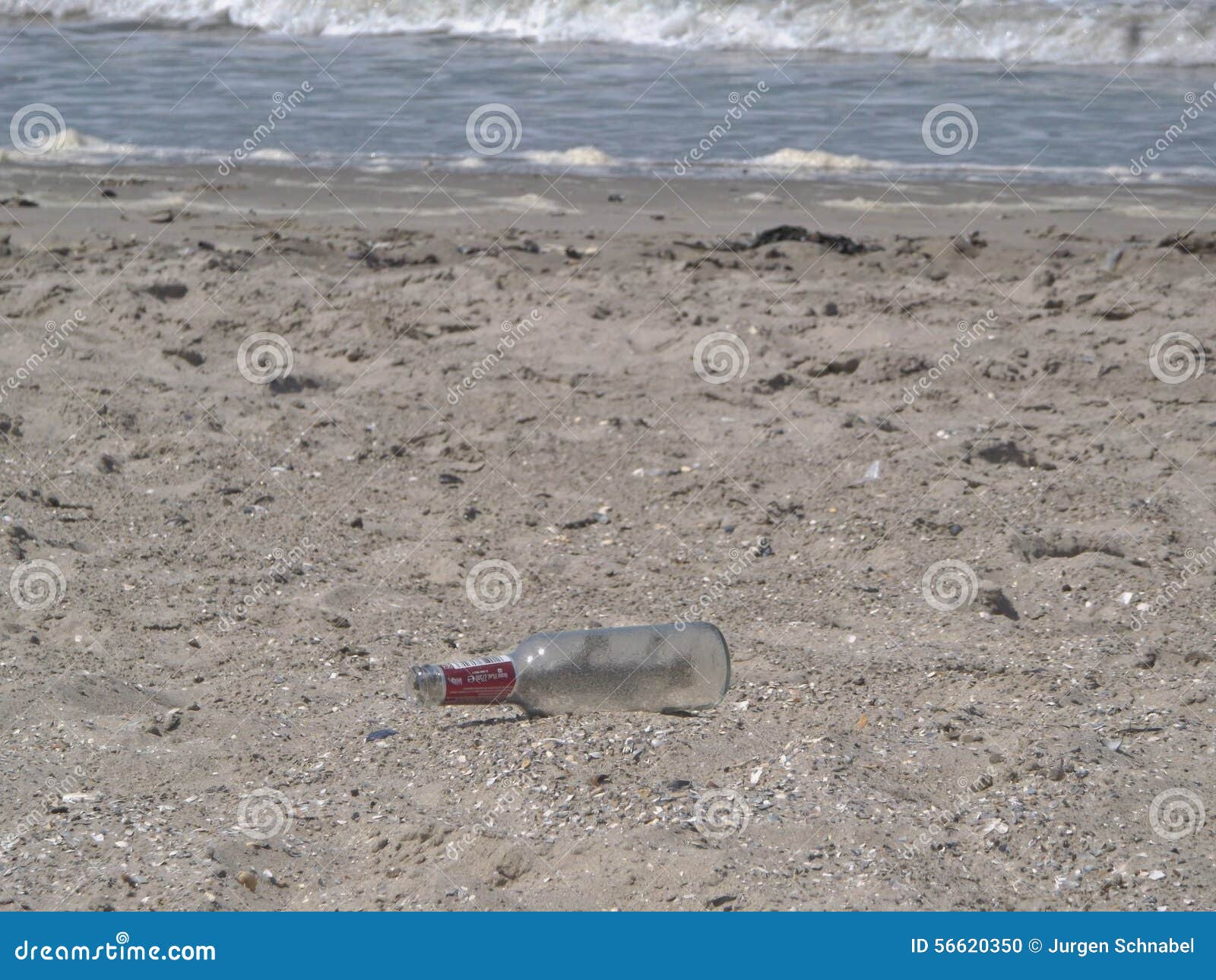 Stranded Bottle at the Beach Stock Photo - Image of laying, water: 56620350