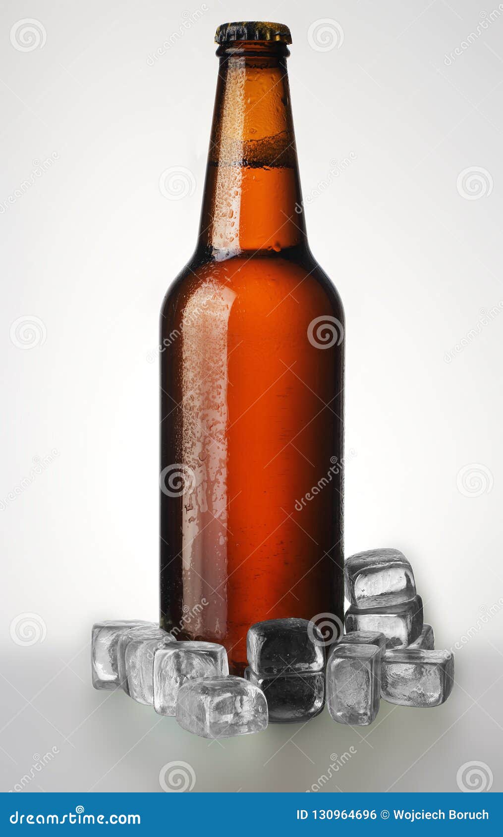 Bottle of beer with ice stock photo. Image of isolated - 130964696