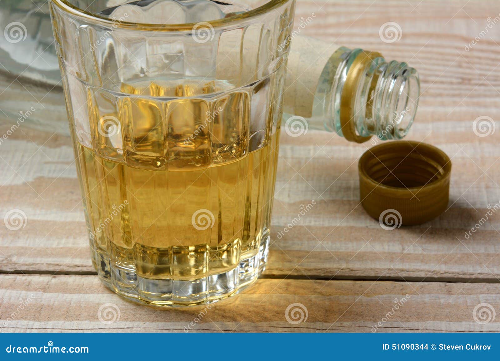 Bottle of Booze and a Glass Stock Photo - Image of wood, glass: 51090344