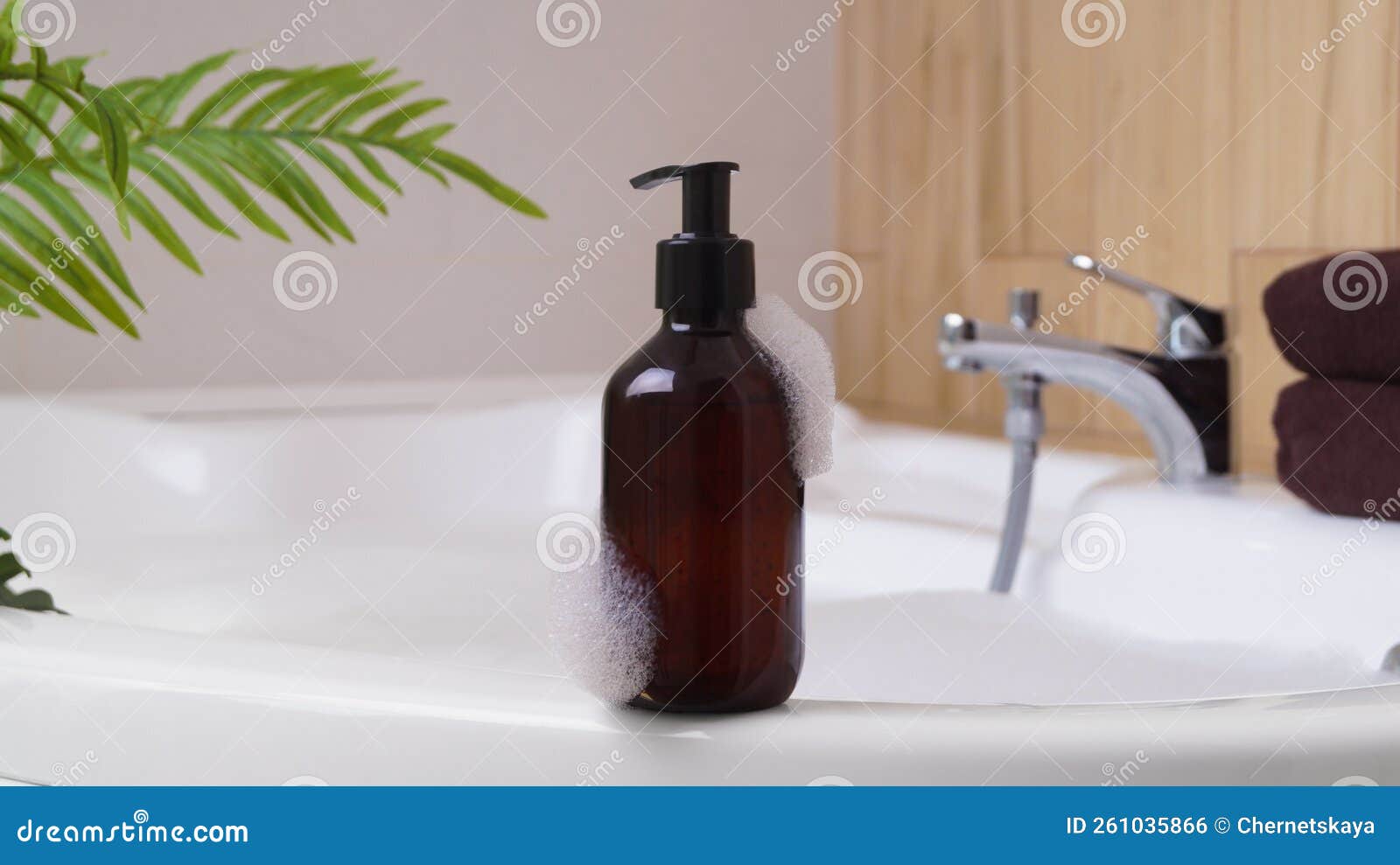 Bottle of Bubble Bath with Foam on Tub Indoors Stock Photo - Image of ...