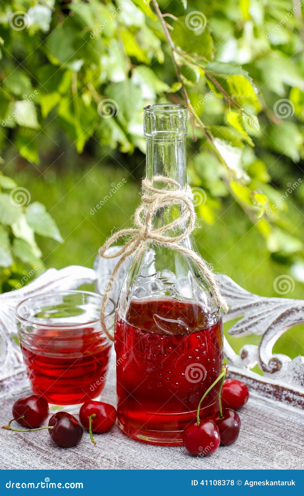 Bottle of Cherry Juice in the Garden Stock Photo - Image of preserves ...