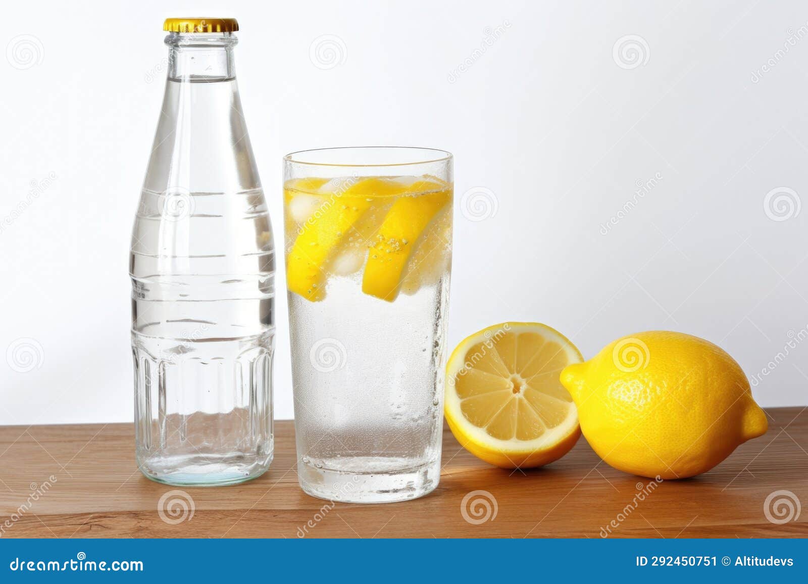 A Bottle of Club Soda Positioned with Fresh Lemons Stock Image - Image ...