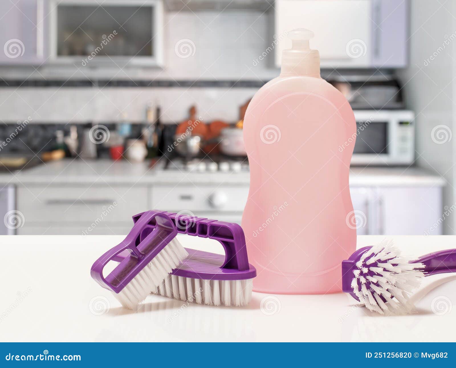 Bottle of Dishwashing Liquid and Brushes in the Kitchen. Stock Photo ...