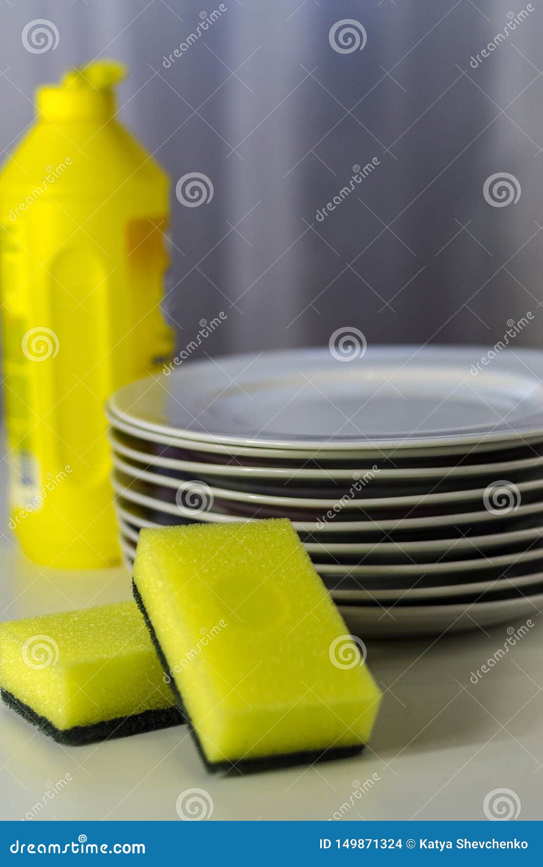 Bottle of Dishwashing Liquid and Stack of Utensils Stock Photo - Image ...