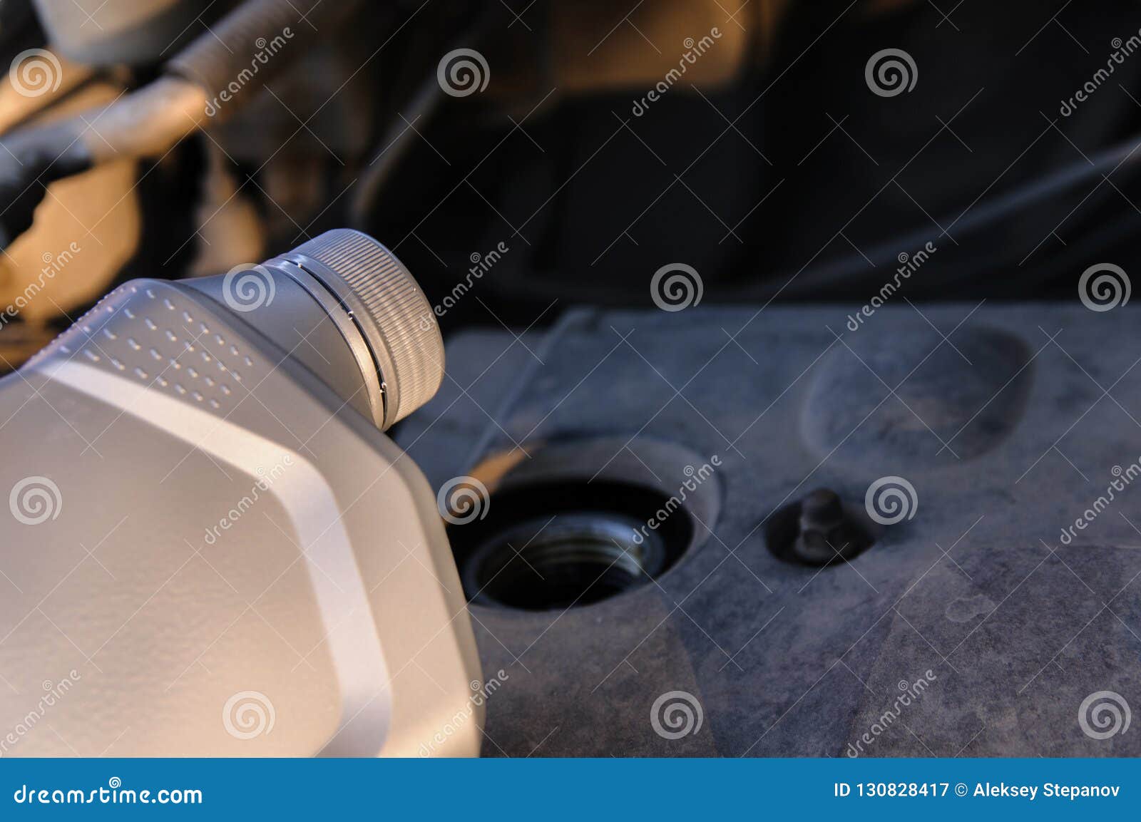 Bottle Of Engine Oil On The Background Of The Engine Stock Image ...