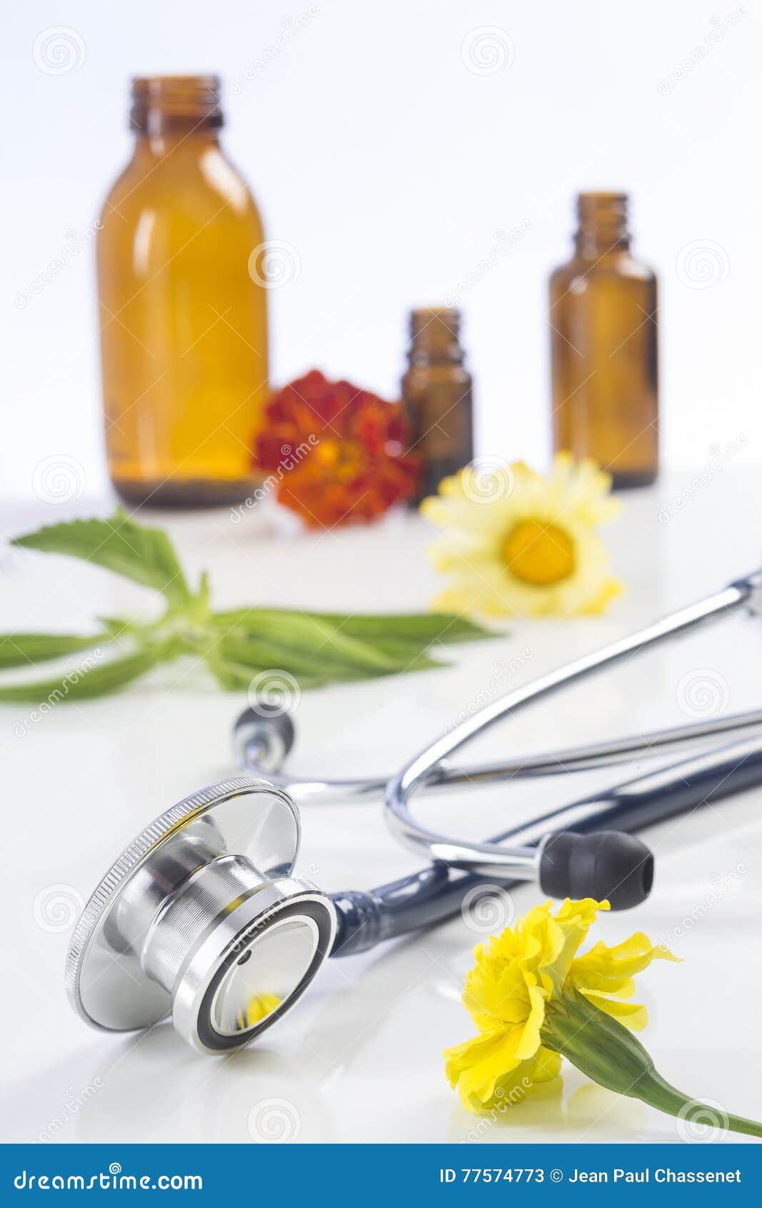Bottle of Essential Oil with Medicinal Plant and Stethoscope Stock ...