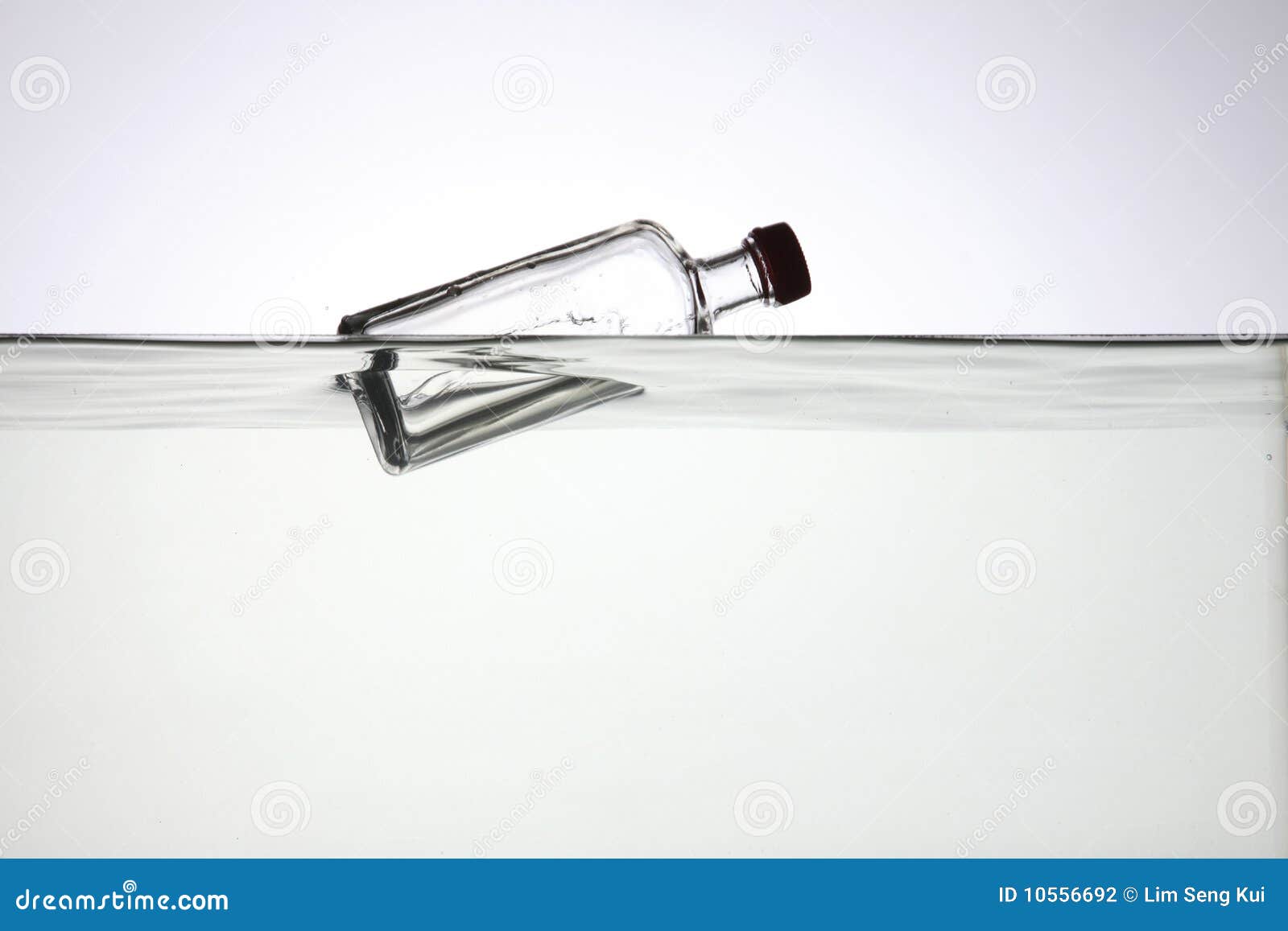 Bottle floating stock photo. Image of float, water, liquid - 10556692