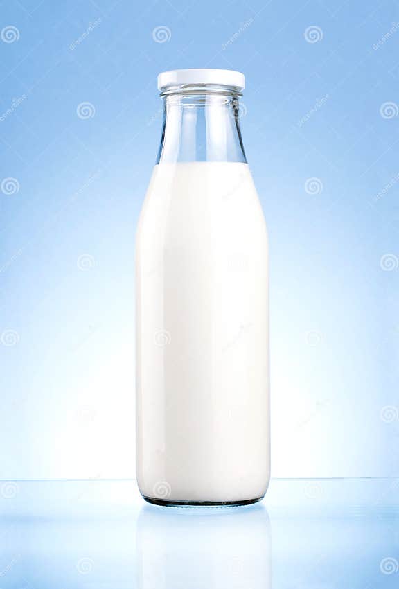 Bottle of Fresh Milk on a Blue Stock Photo - Image of liquid, full ...