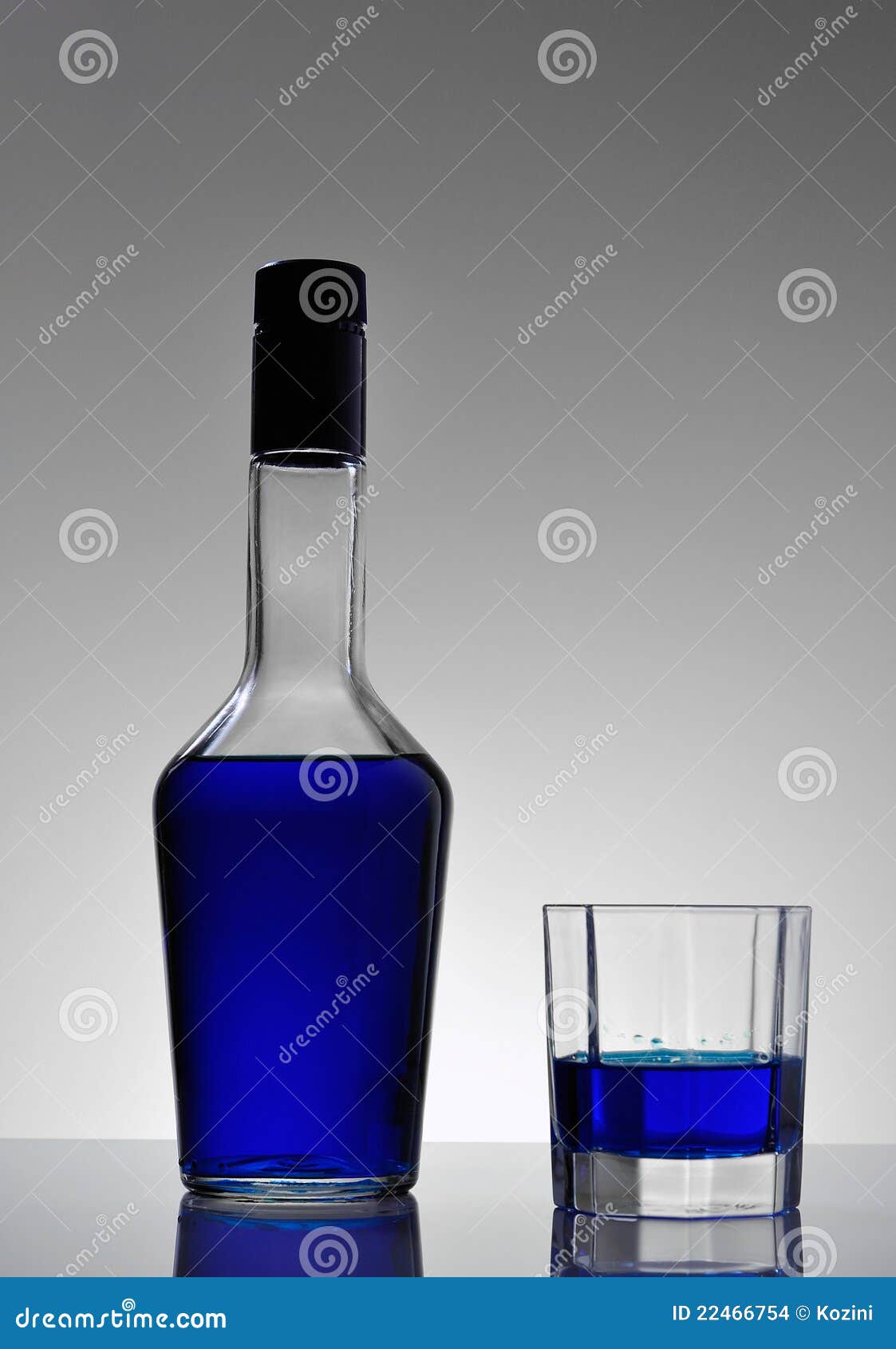 Bottle and Glass with Blue Liquid Stock Photo - Image of beverage ...