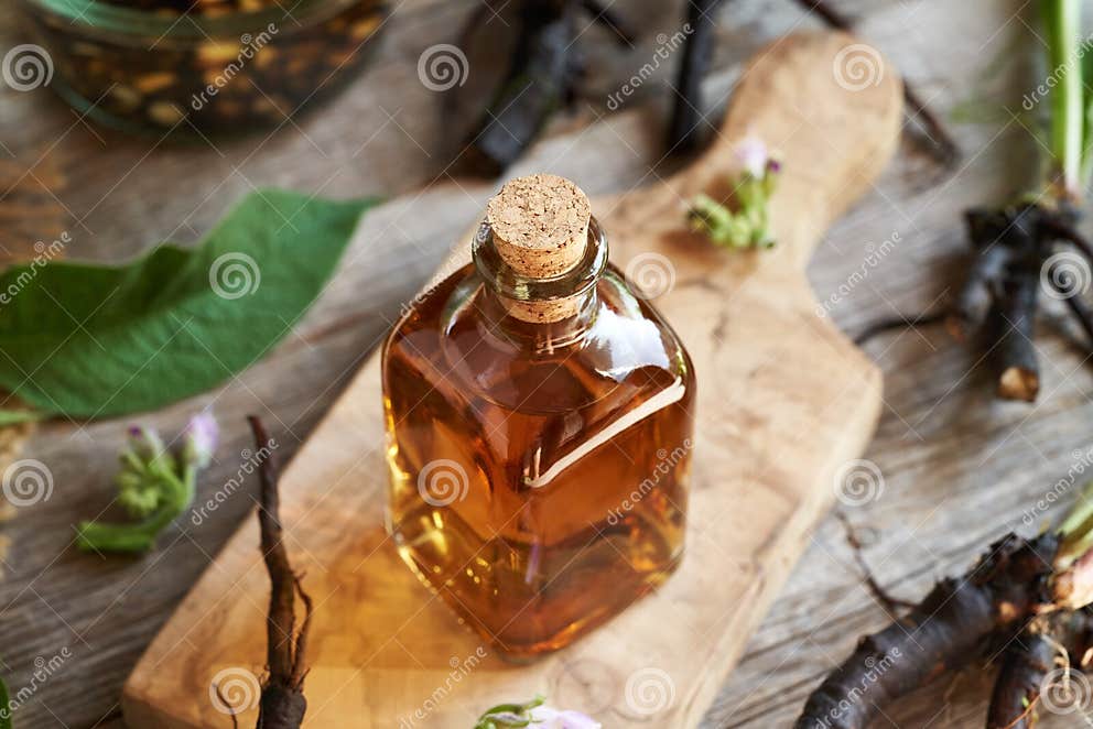 A Bottle of Herbal Tincture with Comfrey Root Stock Image - Image of ...