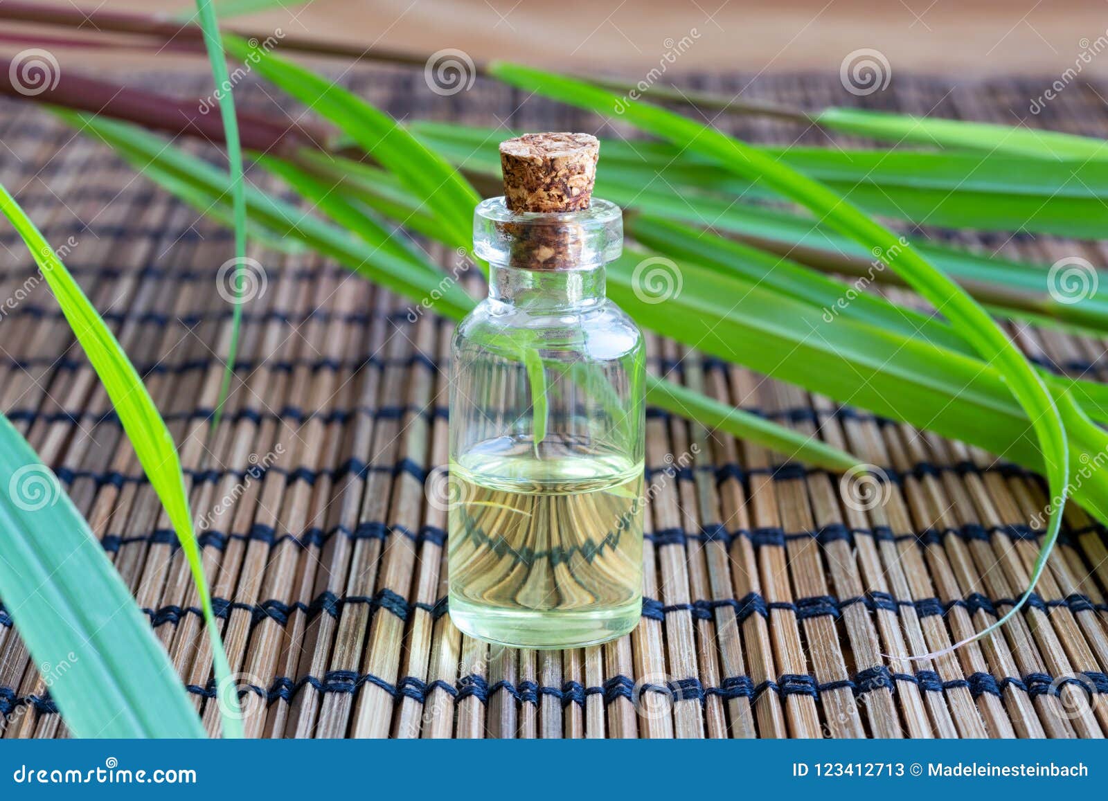 A Bottle of Lemon Grass Essential Oil with Fresh Lemon Grass Stock ...