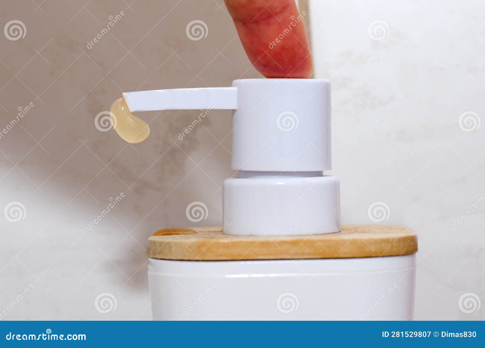 Bottle with Liquid Soap. Press Your Finger on the Cap and Squeeze Out ...