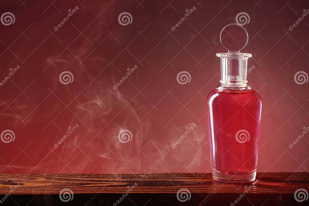 Bottle with Magic Potion in Smoke on Red Backround Stock Photo - Image ...