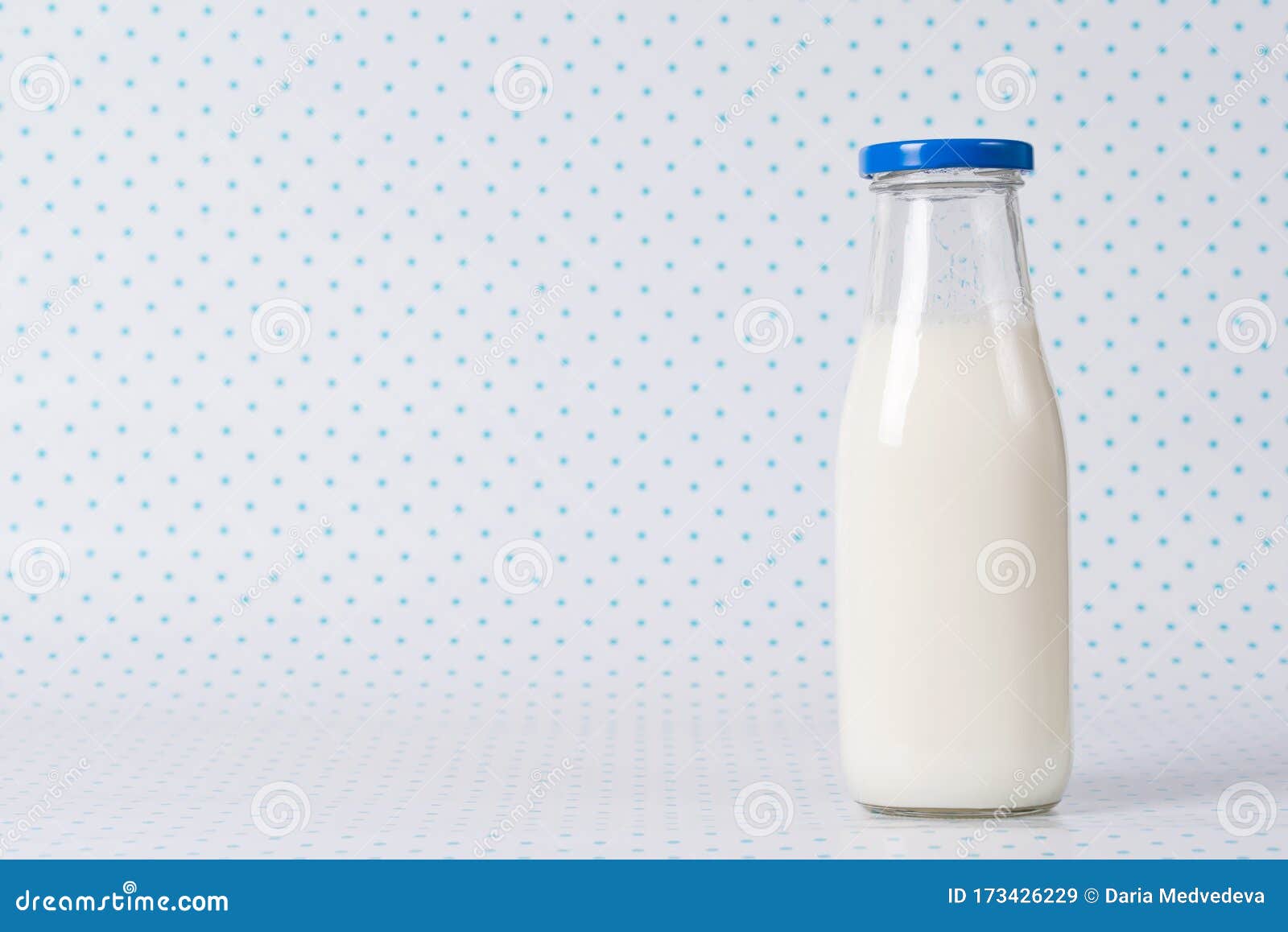 Bottle of Milk with Blue Cap on Polka Dots Background Stock Image ...