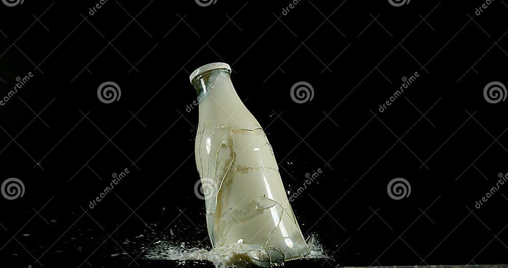 Bottle of Milk Exploding Against Black Background Stock Photo - Image ...