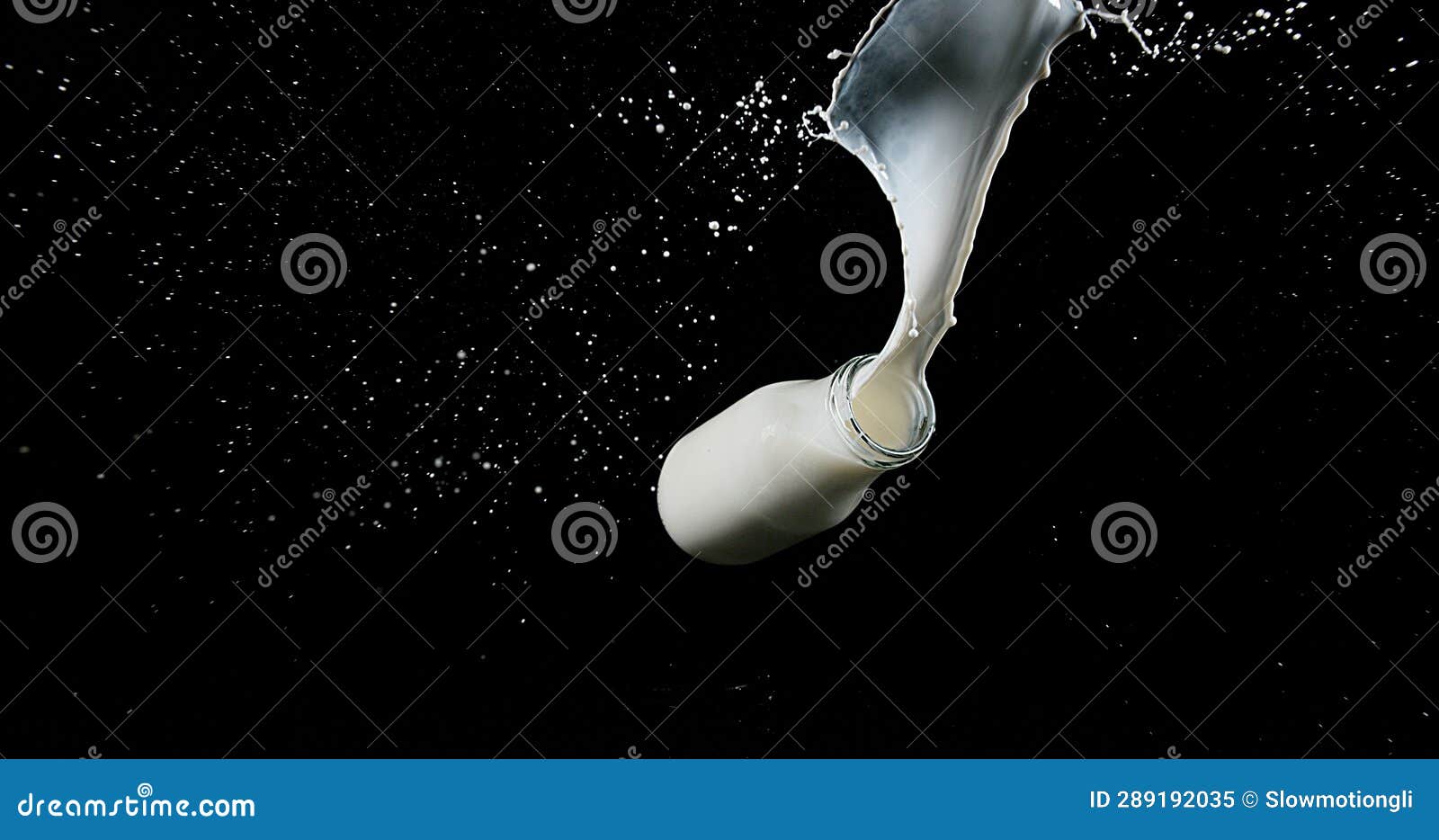 Bottle of Milk Falling and Exploging Against Black Background Stock ...