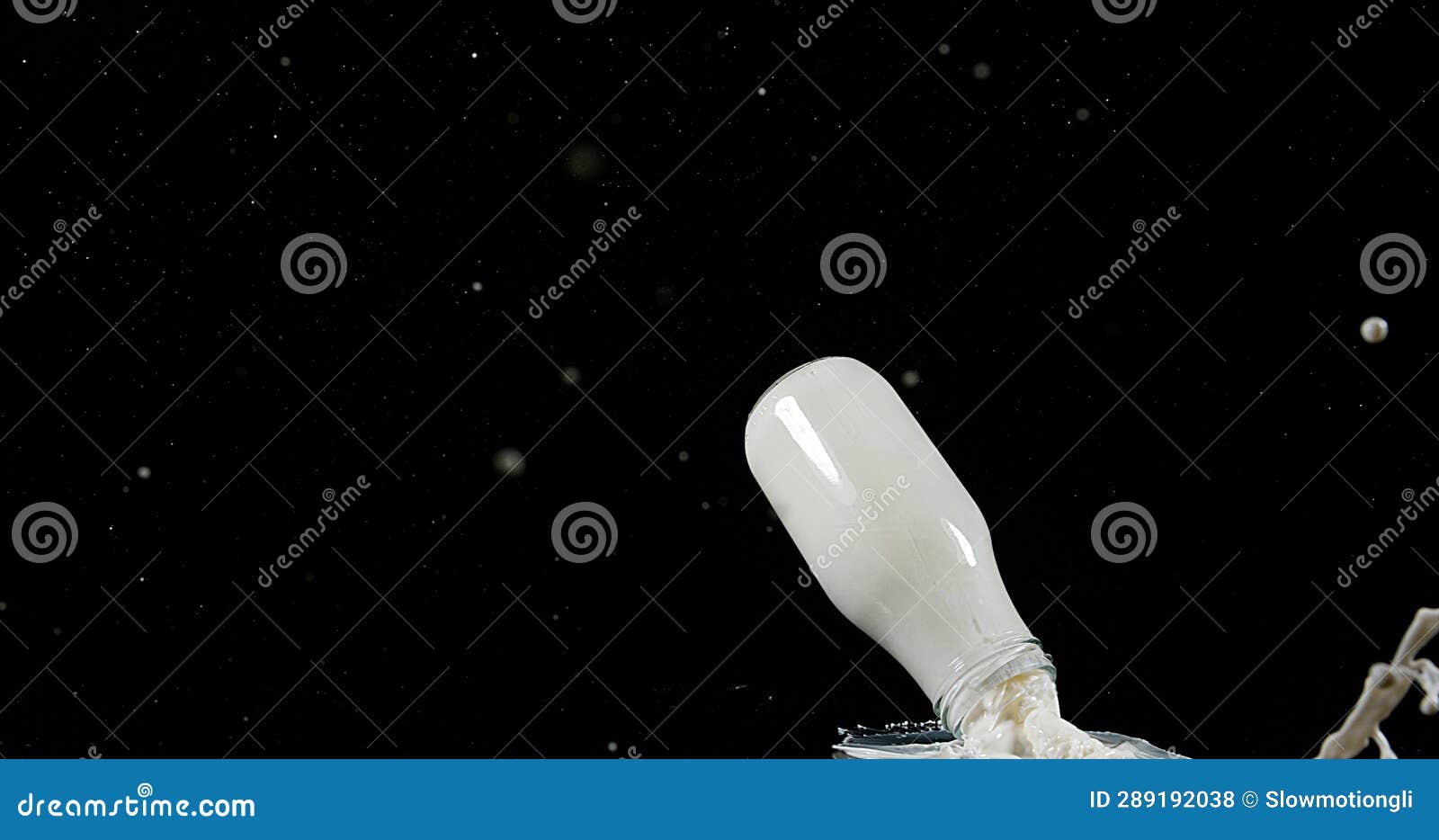 Bottle of Milk Falling and Exploging Against Black Background Stock ...
