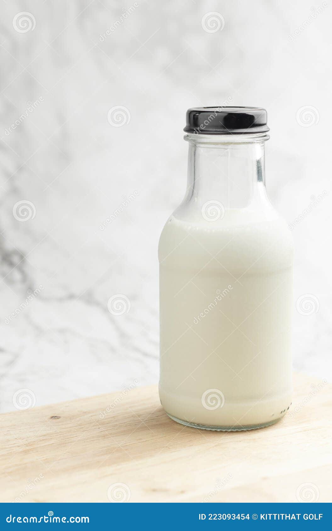 A Bottle of Milk on a Wooden Table Stock Photo - Image of farm, full ...