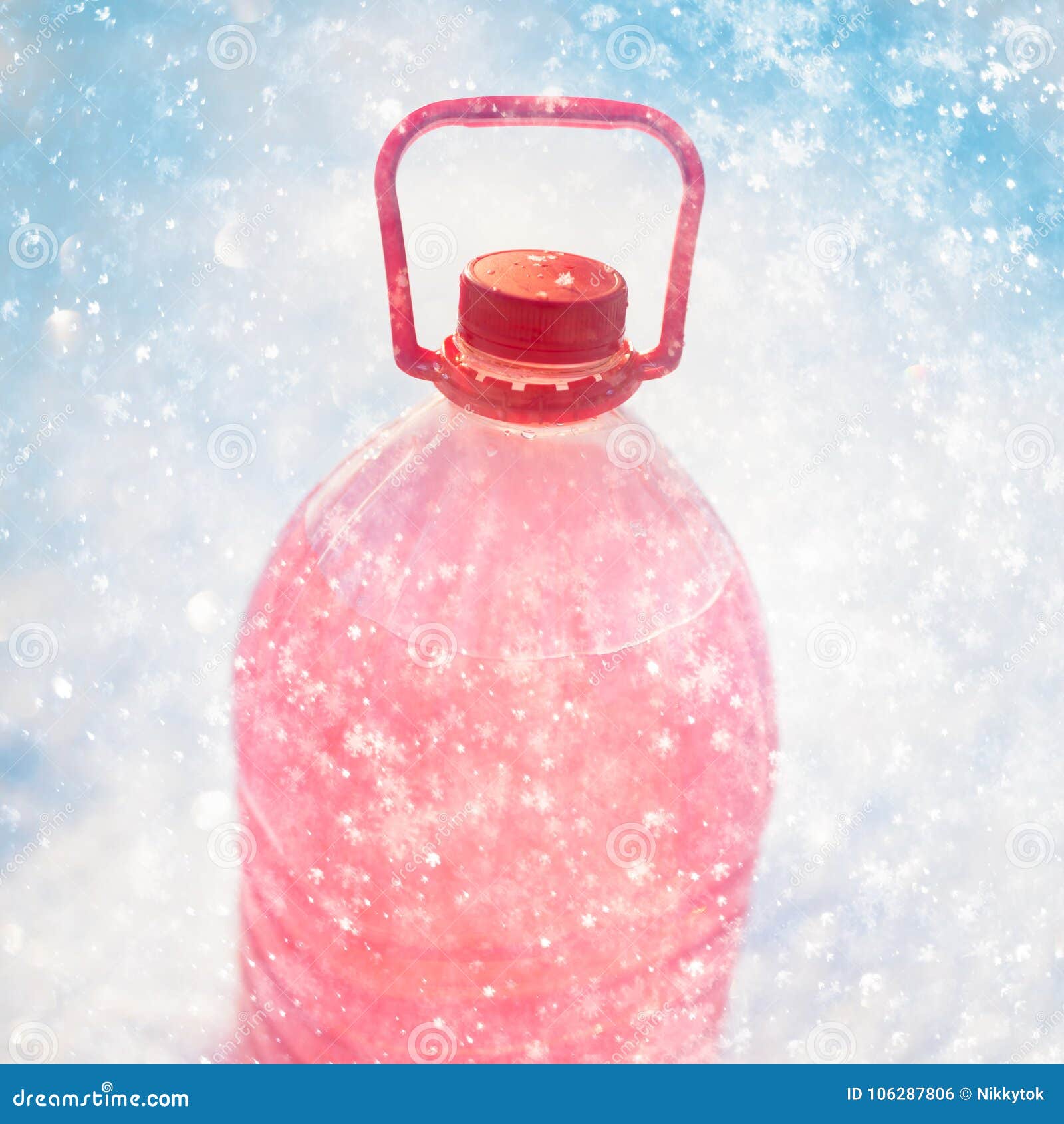 Bottle with Non-freezing Windshield Washer Fluid, Snowflakes Background ...