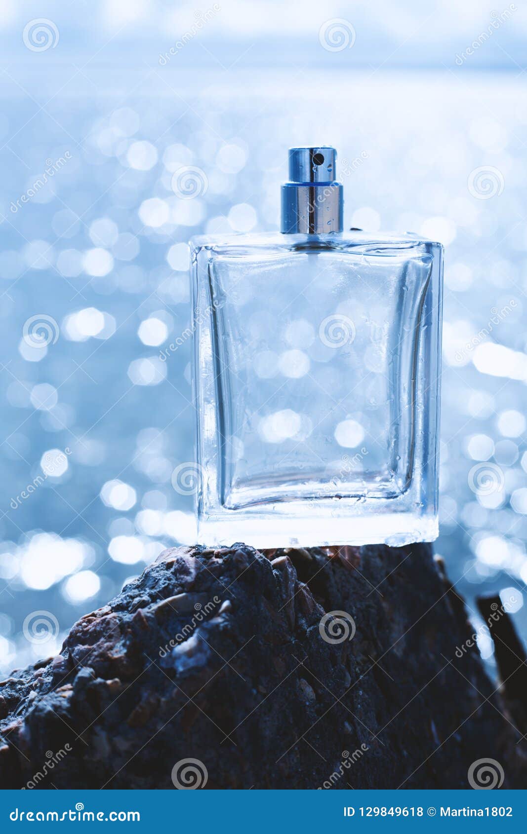 Bottle with Perfume on a Blue Background Stock Photo - Image of ...