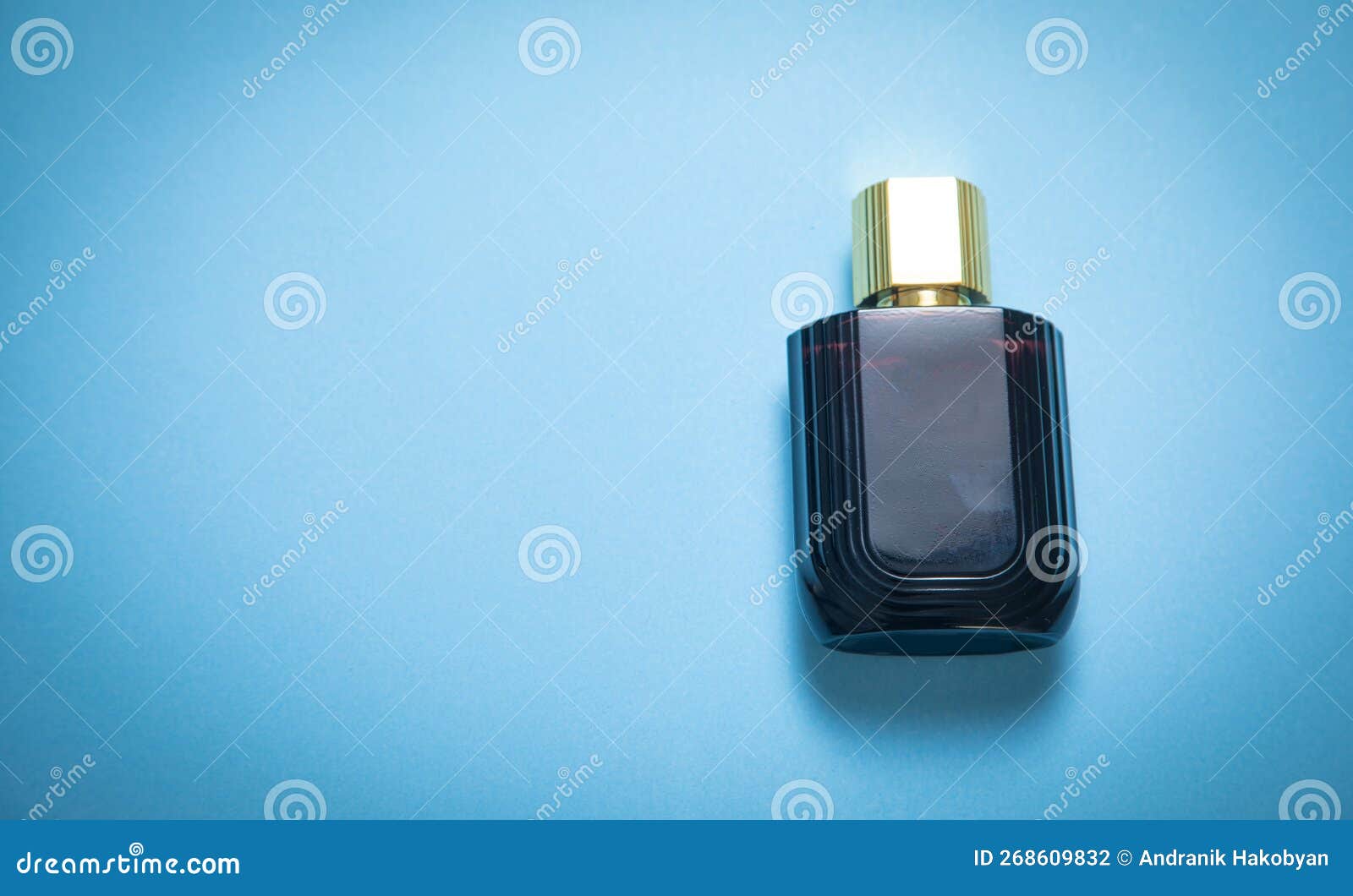 Bottle of Perfume on the Blue Background Stock Photo - Image of glass ...