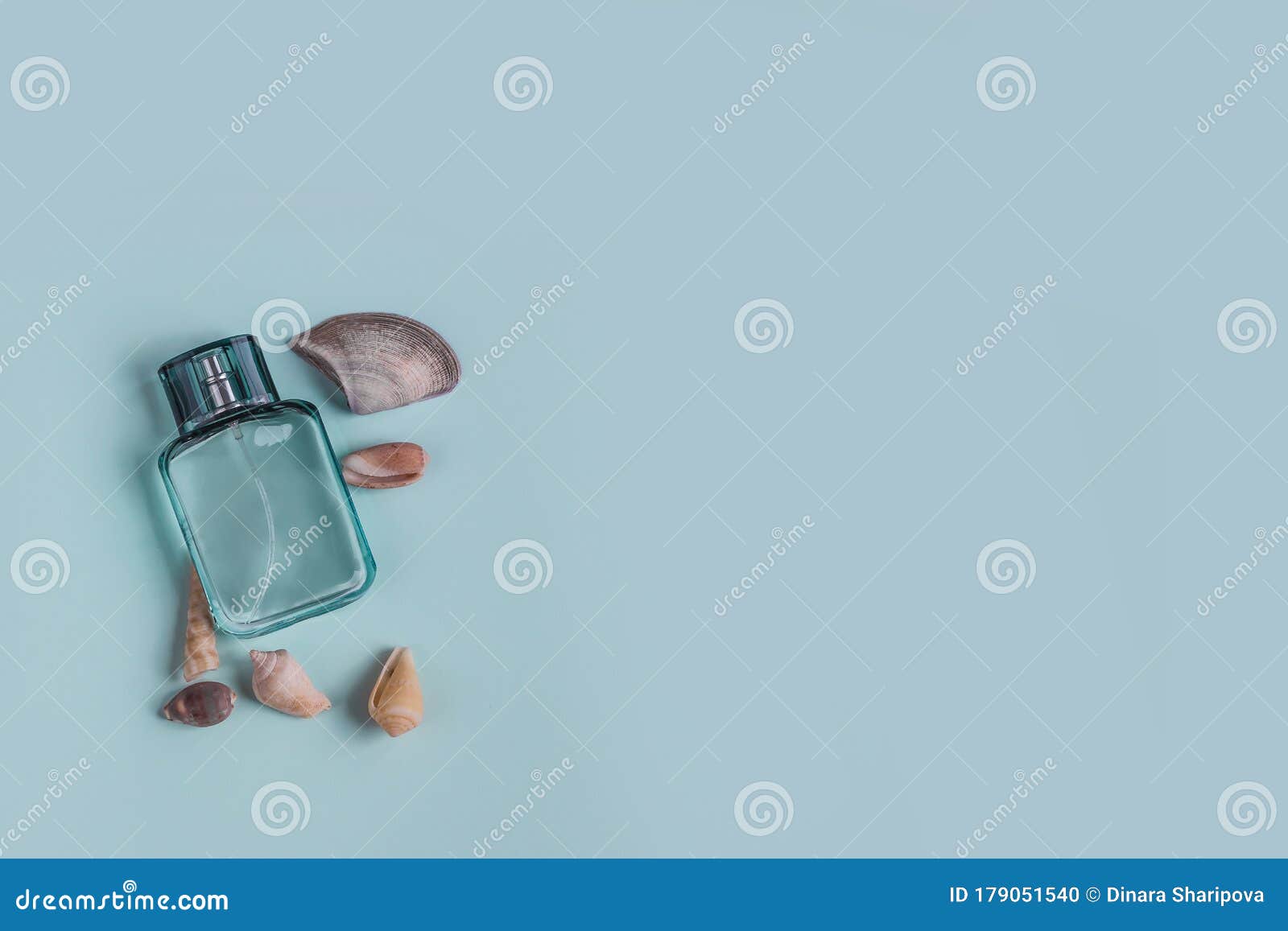 Bottle Perfume on a Blue Background with Shells and Feathers, Nautical ...