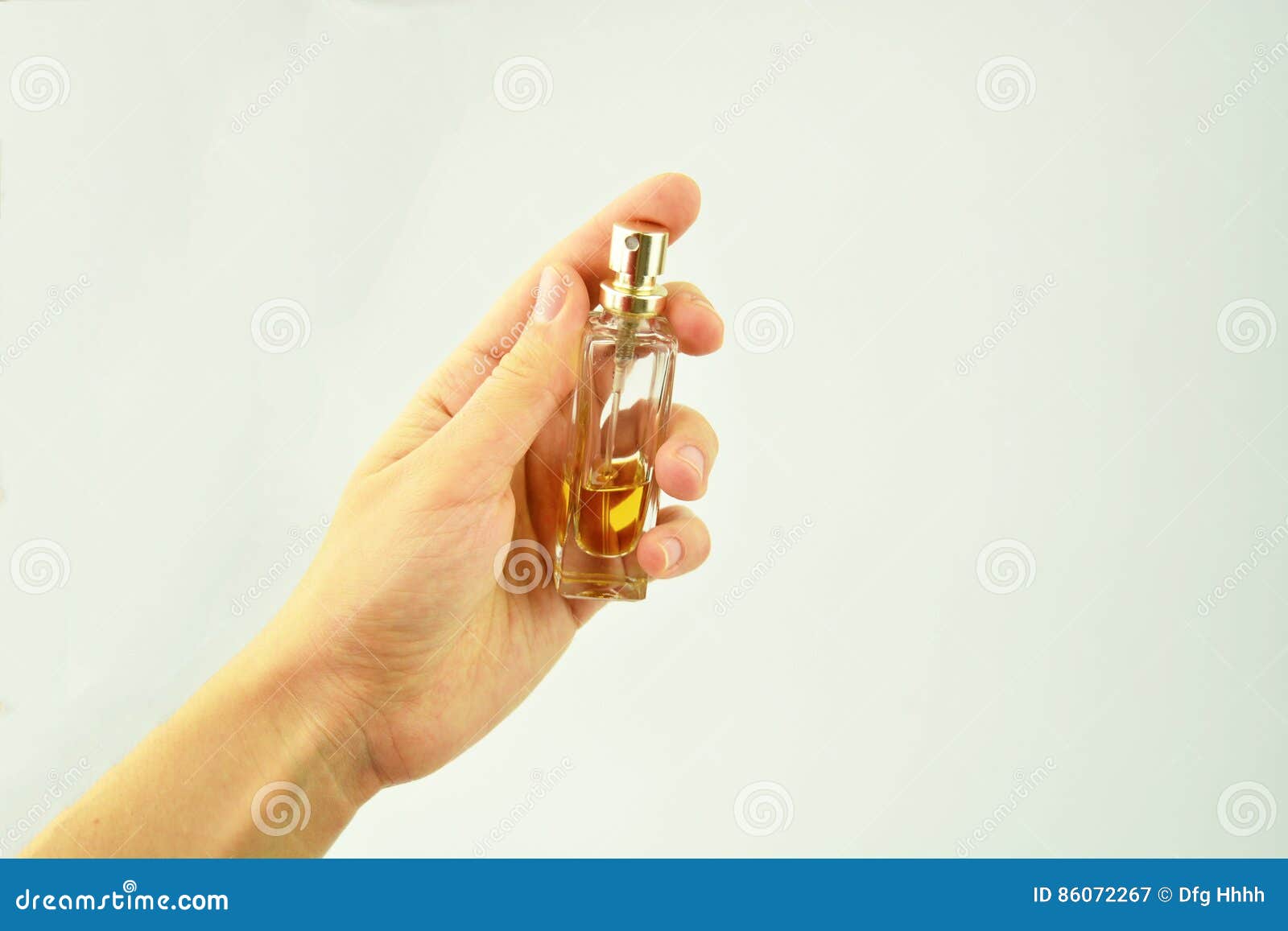 A Bottle of Perfume in a Hand Stock Image - Image of bottle, perfume ...