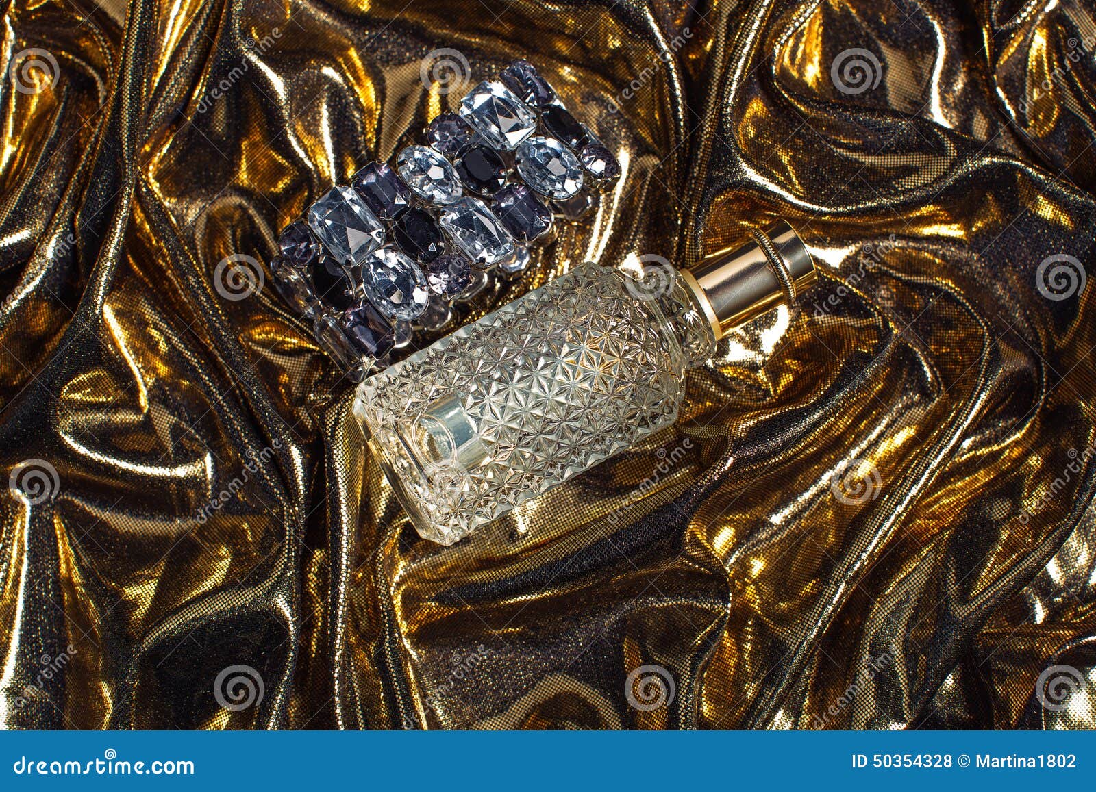 Bottle of Perfume on Shiny Gold Background Stock Photo - Image of ...