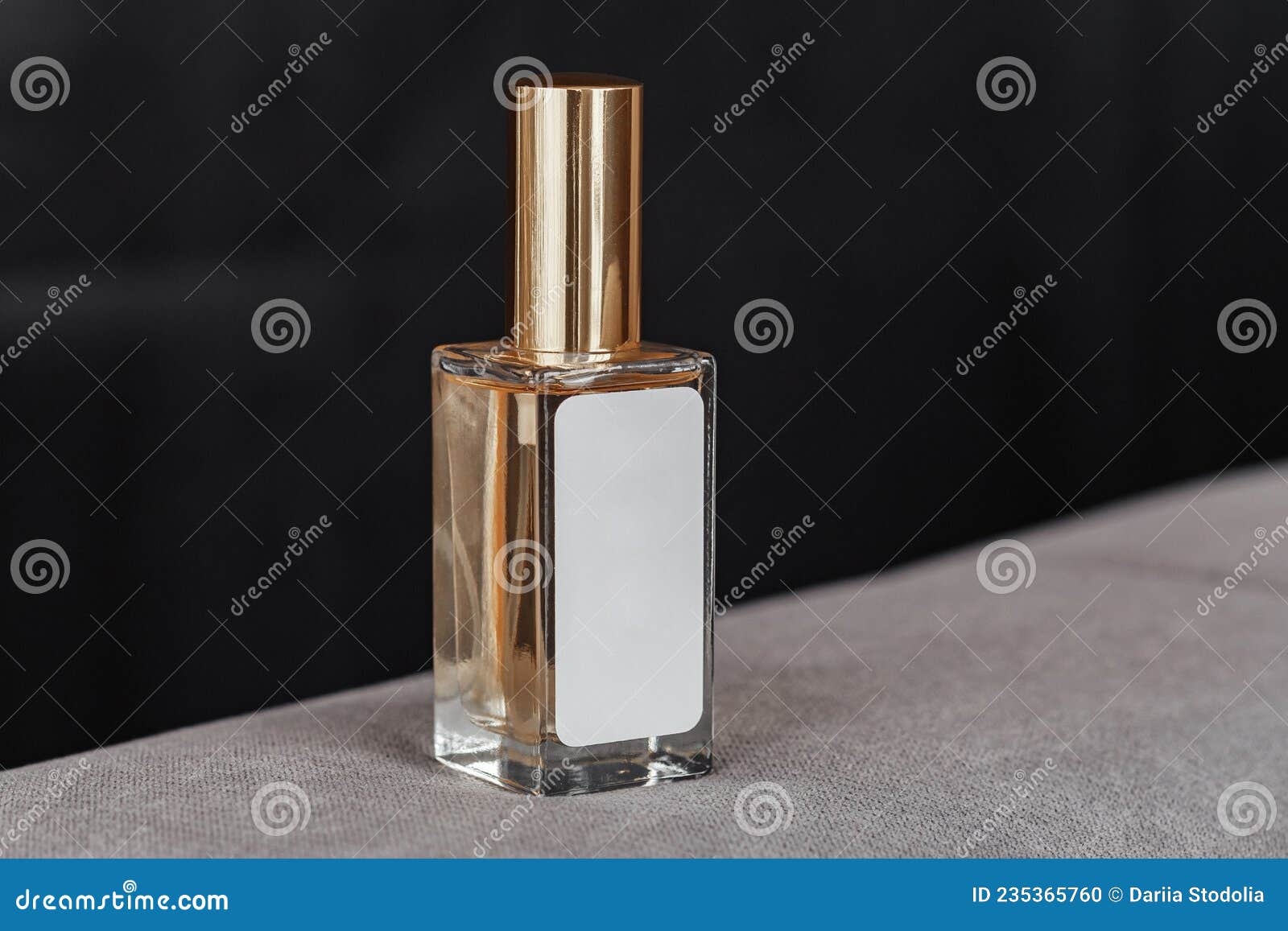A Bottle of Perfume Spray with a Label for Text on a Dark Background ...