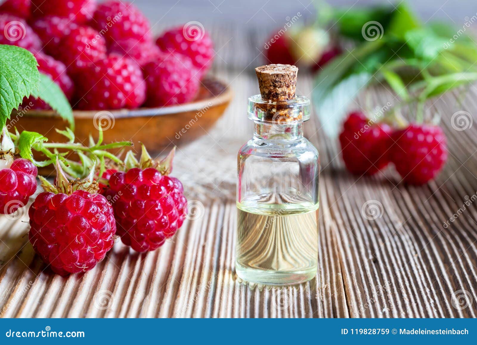 A Bottle of Raspberry Seed Oil with Fresh Raspberries Stock Image ...