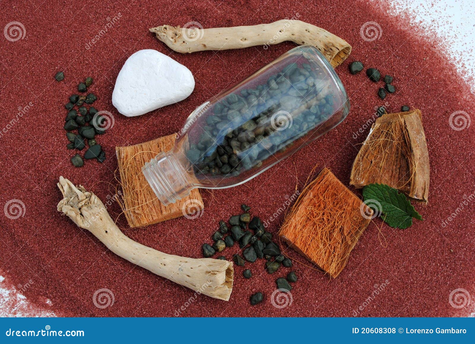 Bottle on Red Sand with Pebbles and Sticks Stock Photo - Image of stick ...