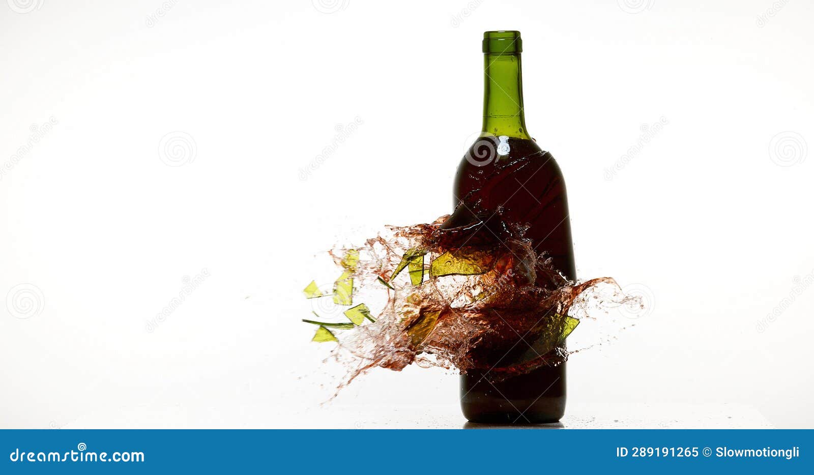 Bottle of Red Wine Breaking and Splashing Against White Background ...