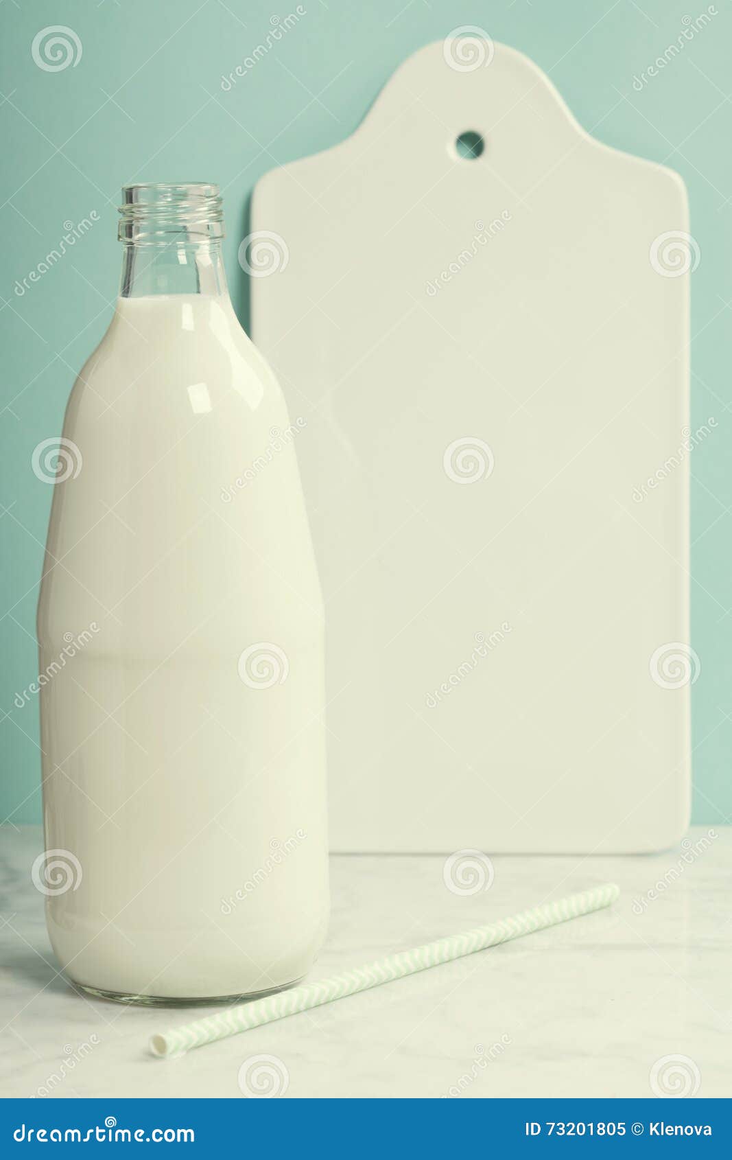 A Bottle of Rustic Milk and Paper Straw on White Marble Table Wi Stock ...