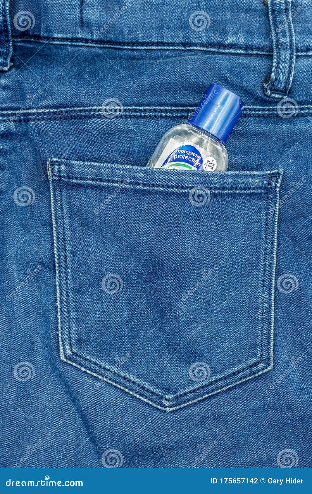 A Bottle of Sanitizing Alcohol Hand Gel in the Back Pocket of a Pair of ...