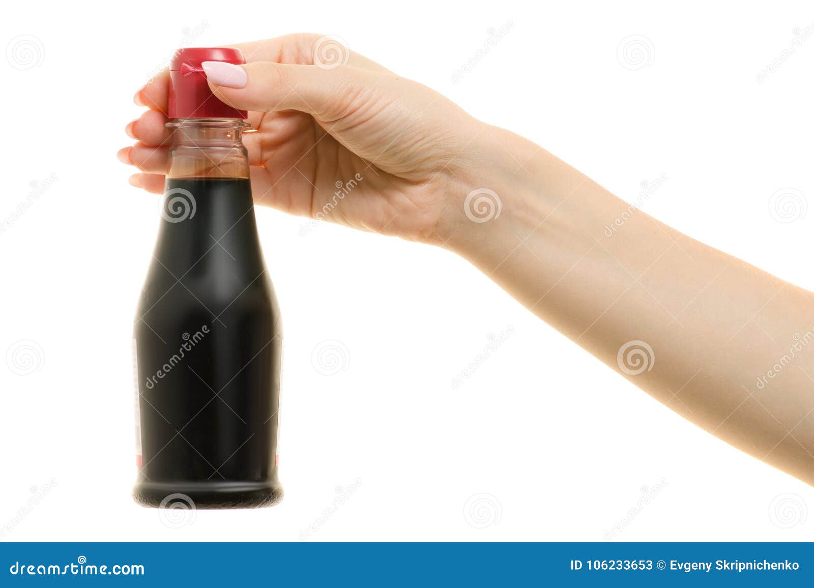 Bottle with sauce in hand stock image. Image of natural - 106233653