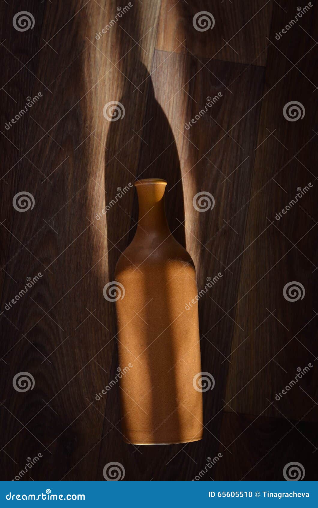 Bottle and shadow stock photo. Image of floor, laminate - 65605510